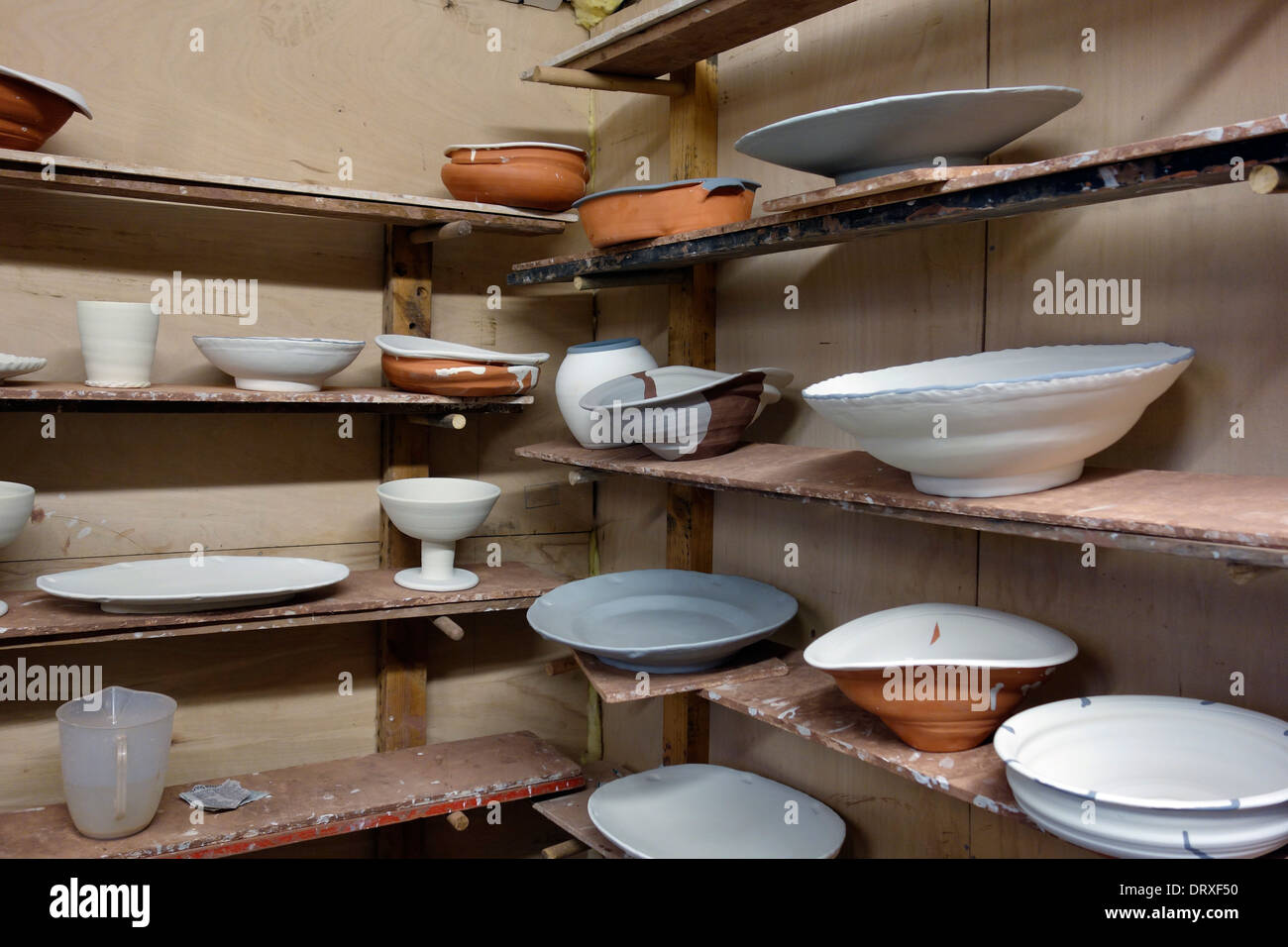 Glazes drying on pots prior to glaze firing - Tilly Young Pottery ...