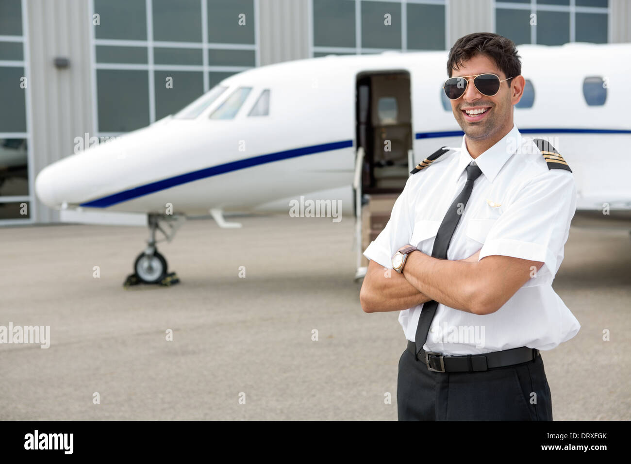 Commercial airplane pilot smiling hi-res stock photography and images ...