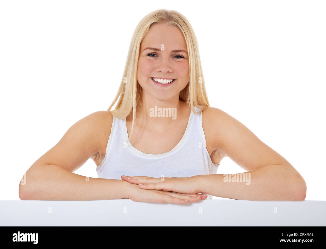 Attractive young woman behind white placeholder. All on white ...