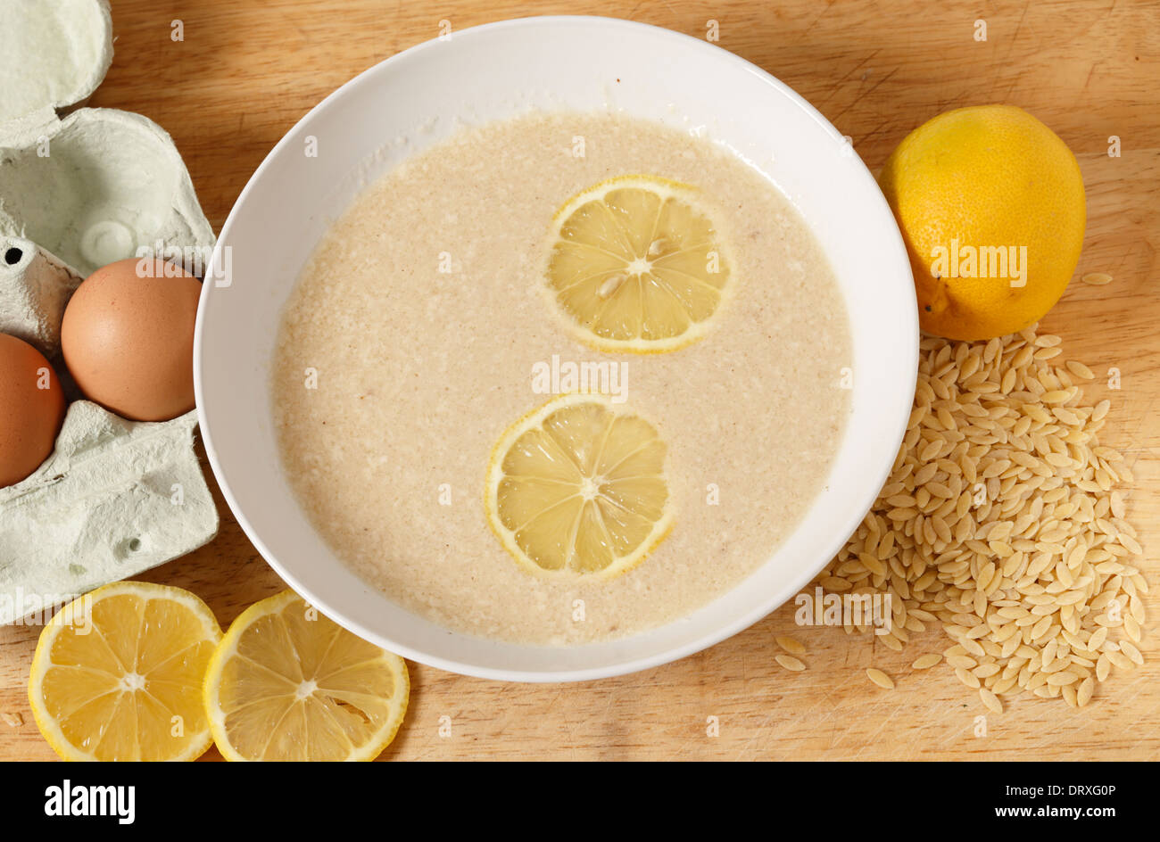 Avgolemono soup - made with chicken broth, lemon, egg and rice-shaped ...