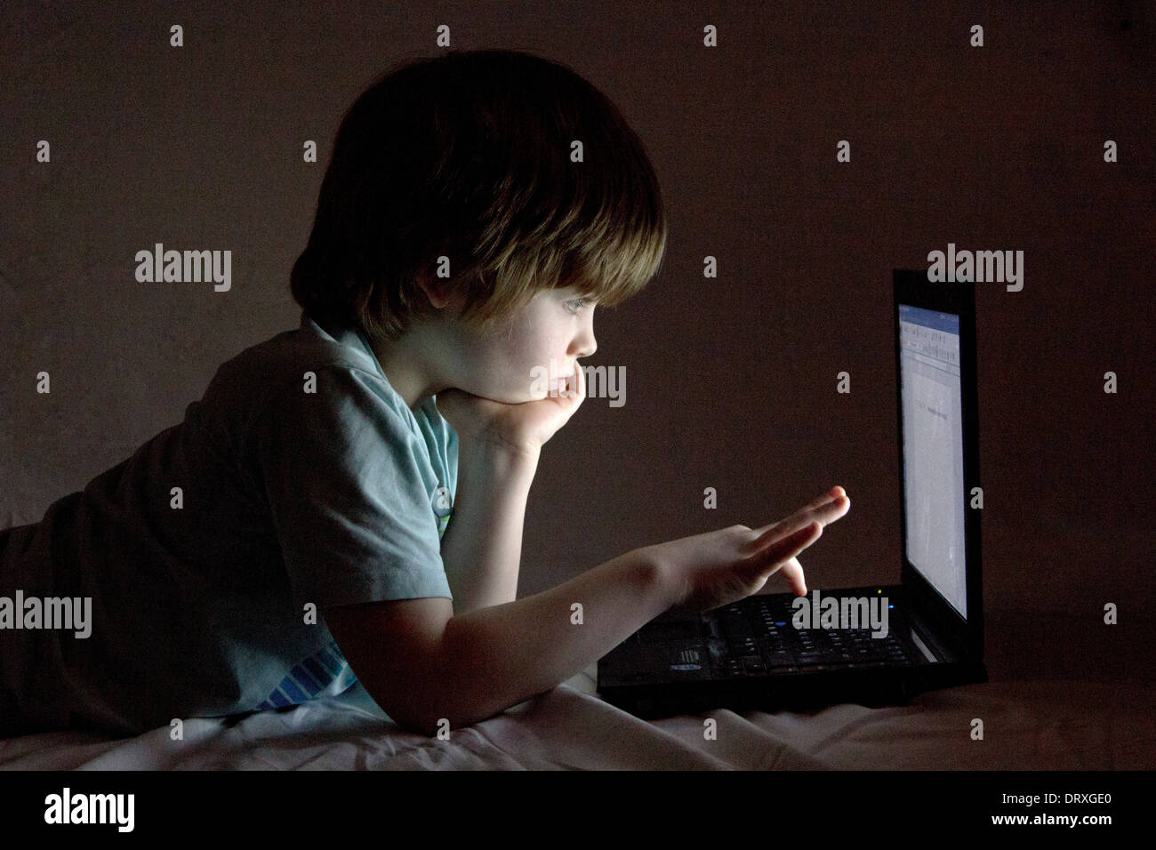 Boy in front of computer hi-res stock photography and images - Alamy