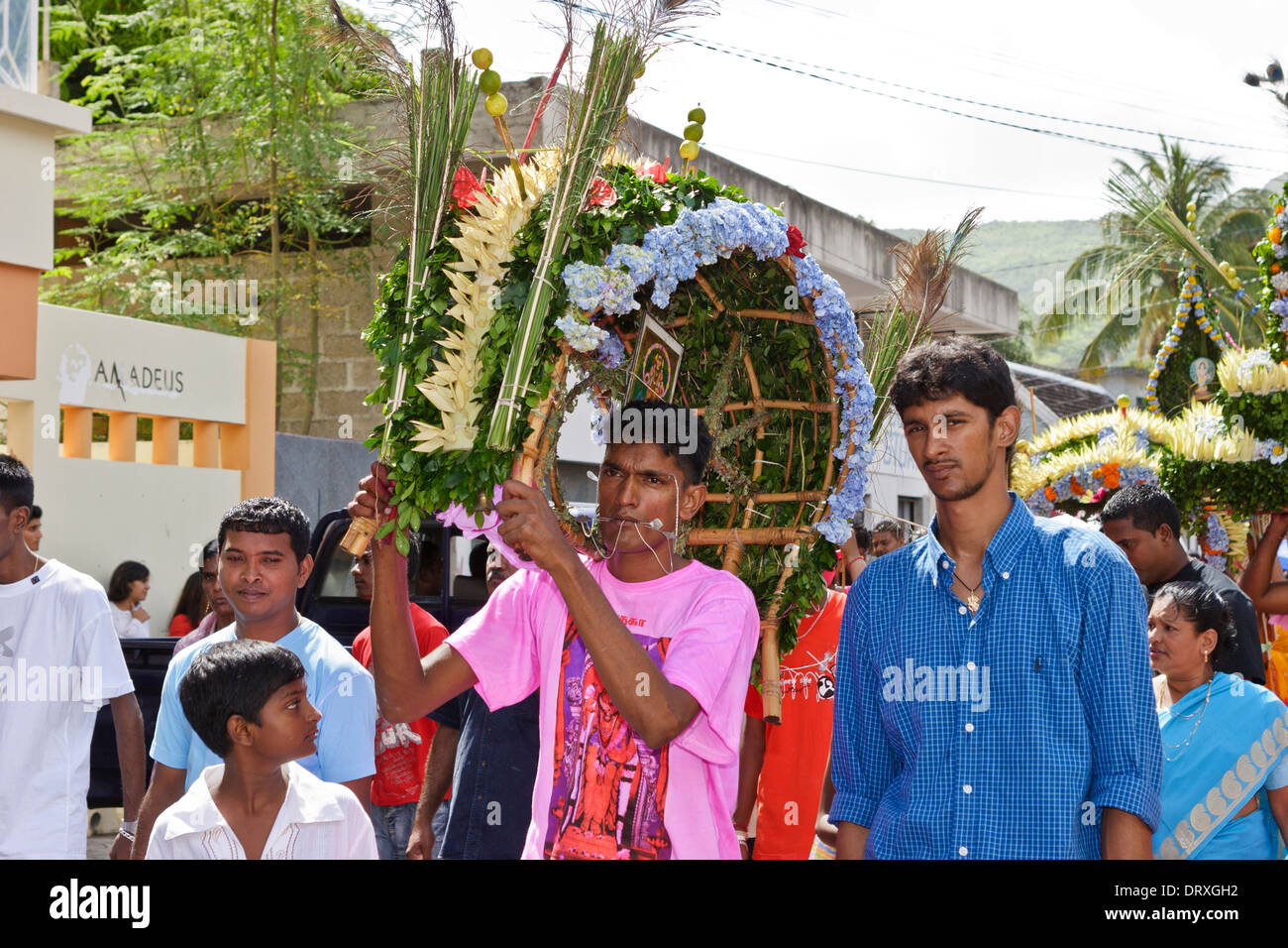 A Tamil devotee carrying a decorative cavadee during the Thaipoosam ...