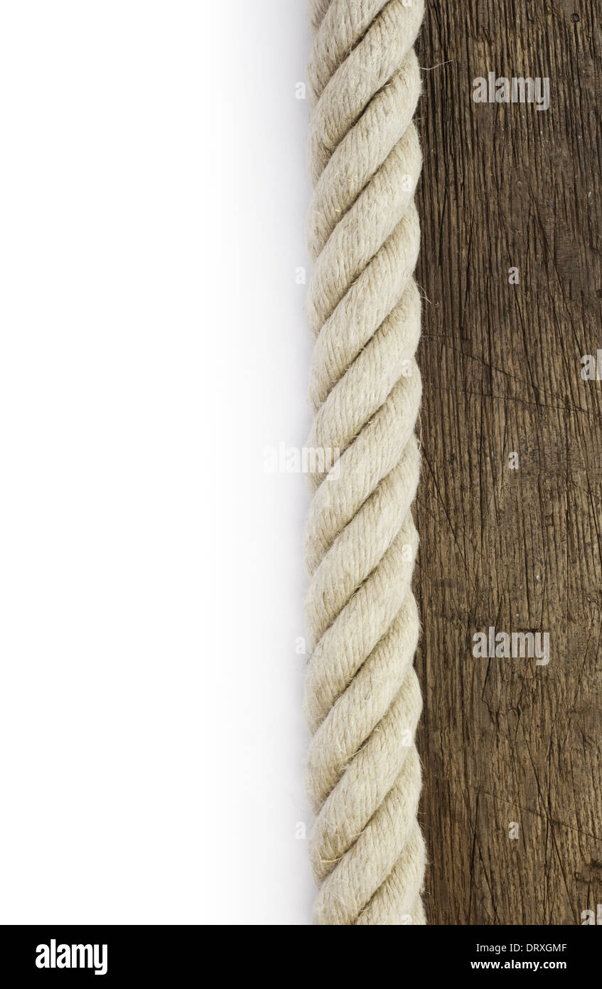 Heavy rope on wooden board. All on white background Stock Photo - Alamy