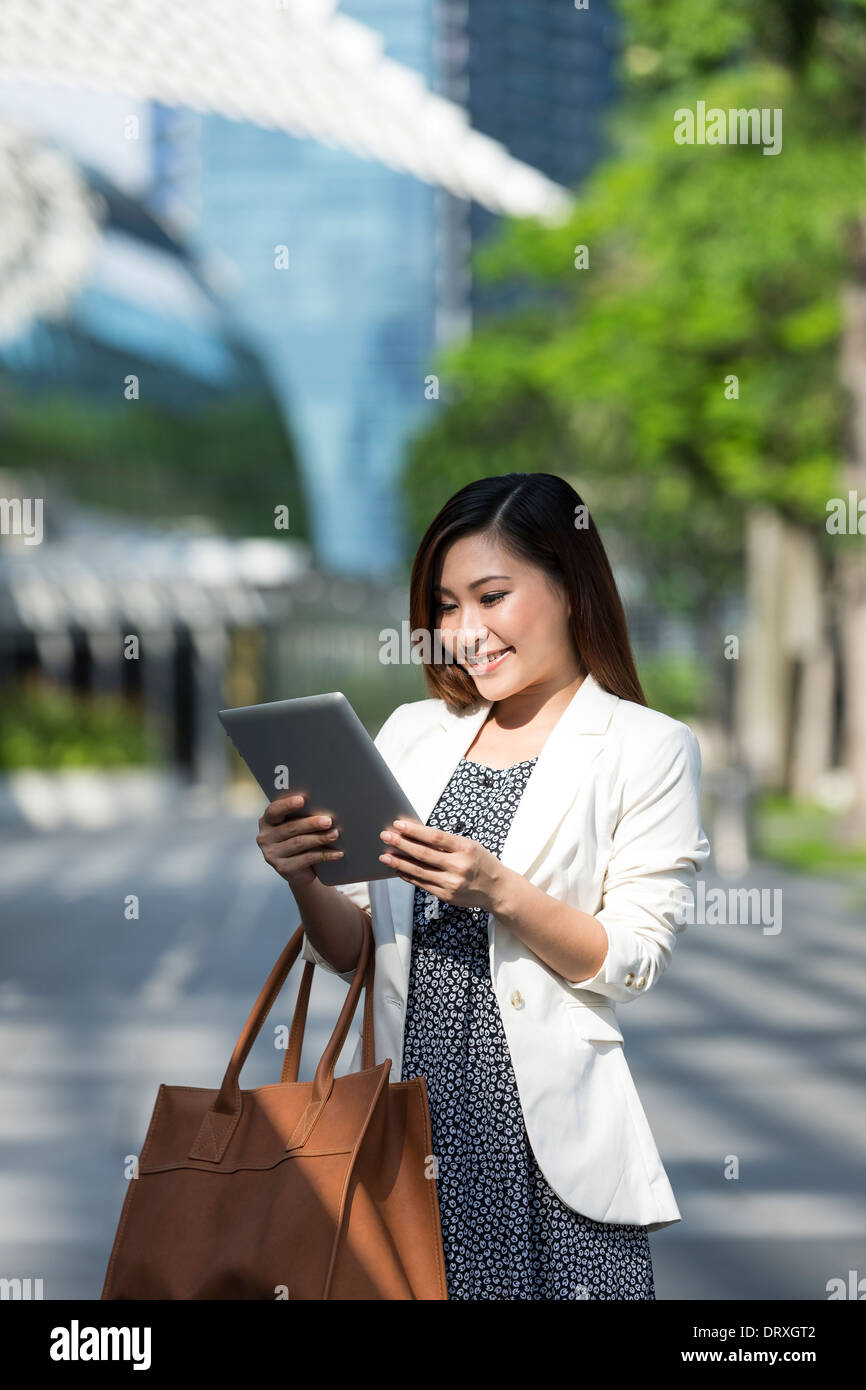 Chinese business woman with a tablet computer. Asian business woman ...