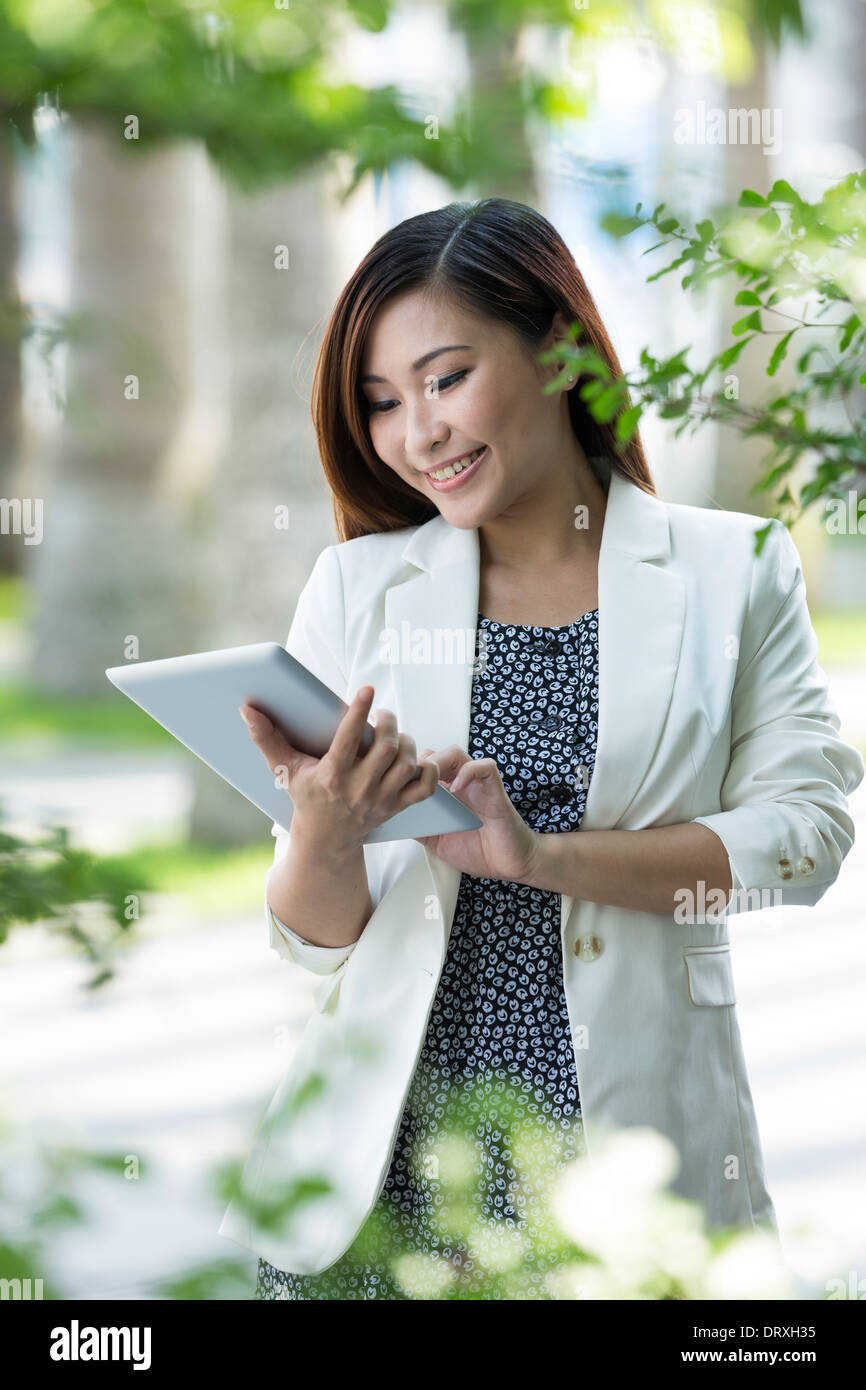 Chinese business woman with a tablet computer. Asian business woman ...