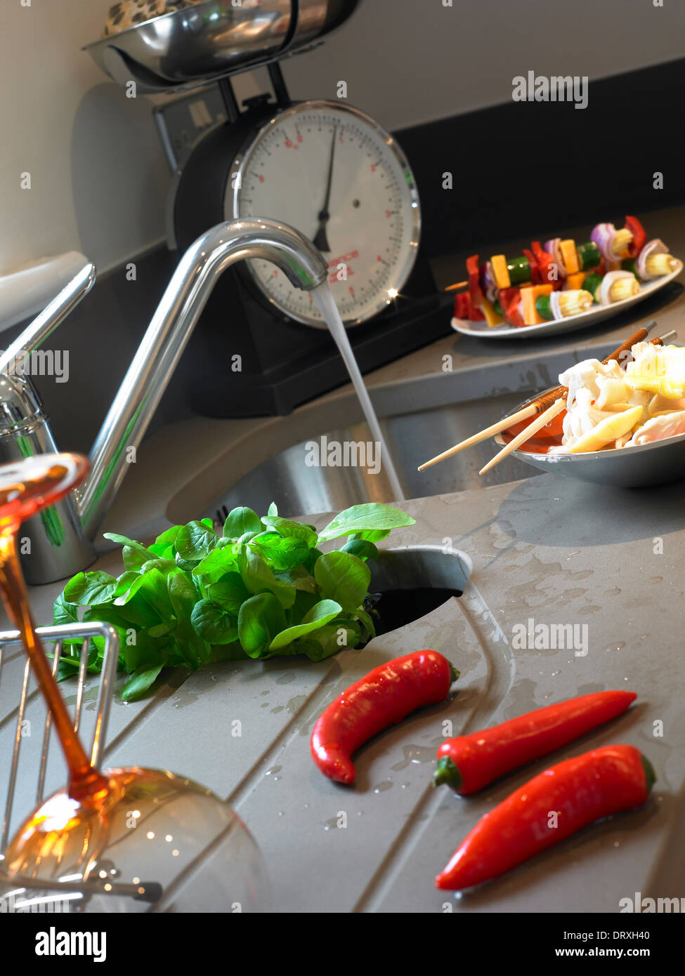 Food preparation at the kitchen sink Stock Photo - Alamy