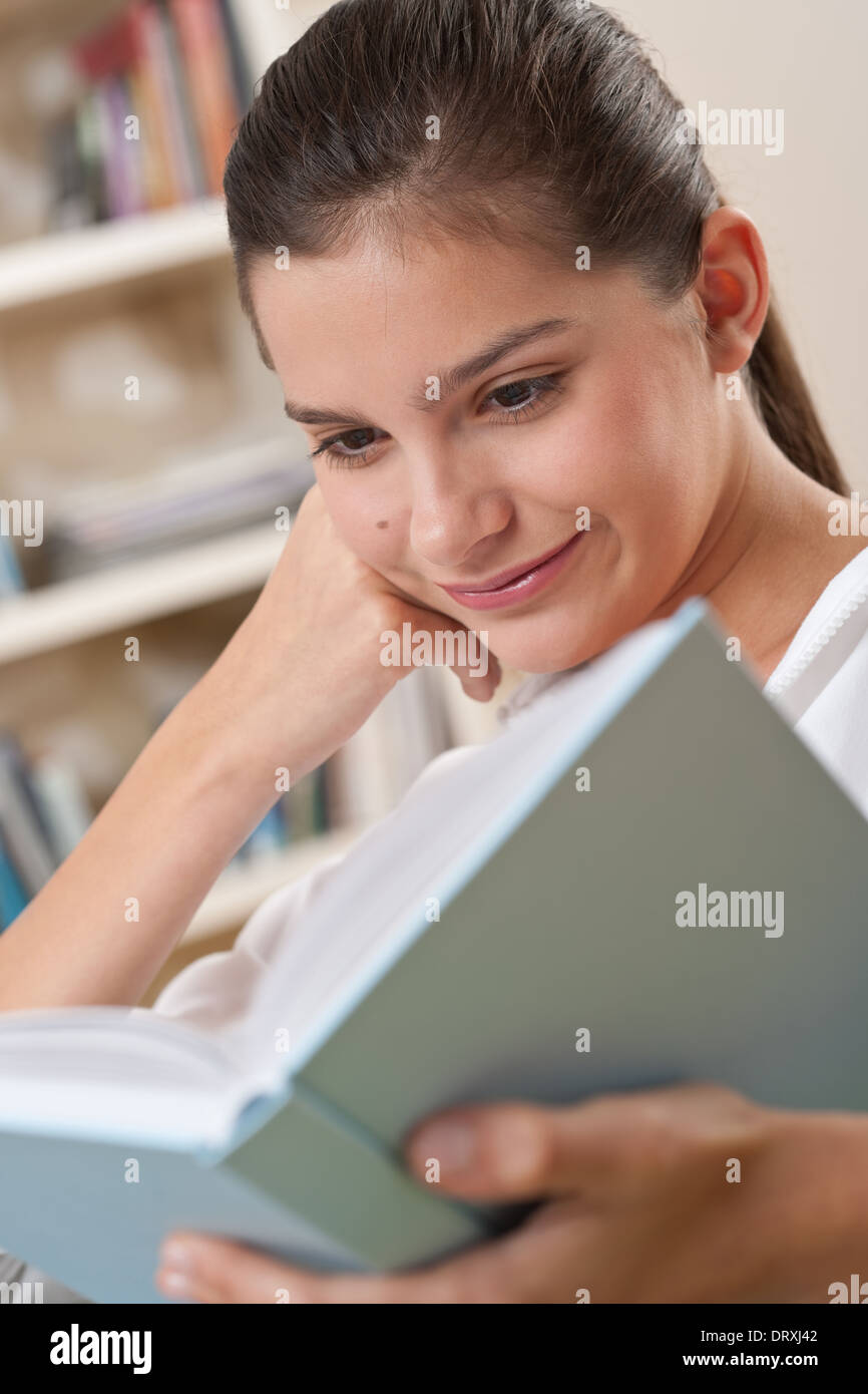 Students - Female teenager reading book Stock Photo - Alamy