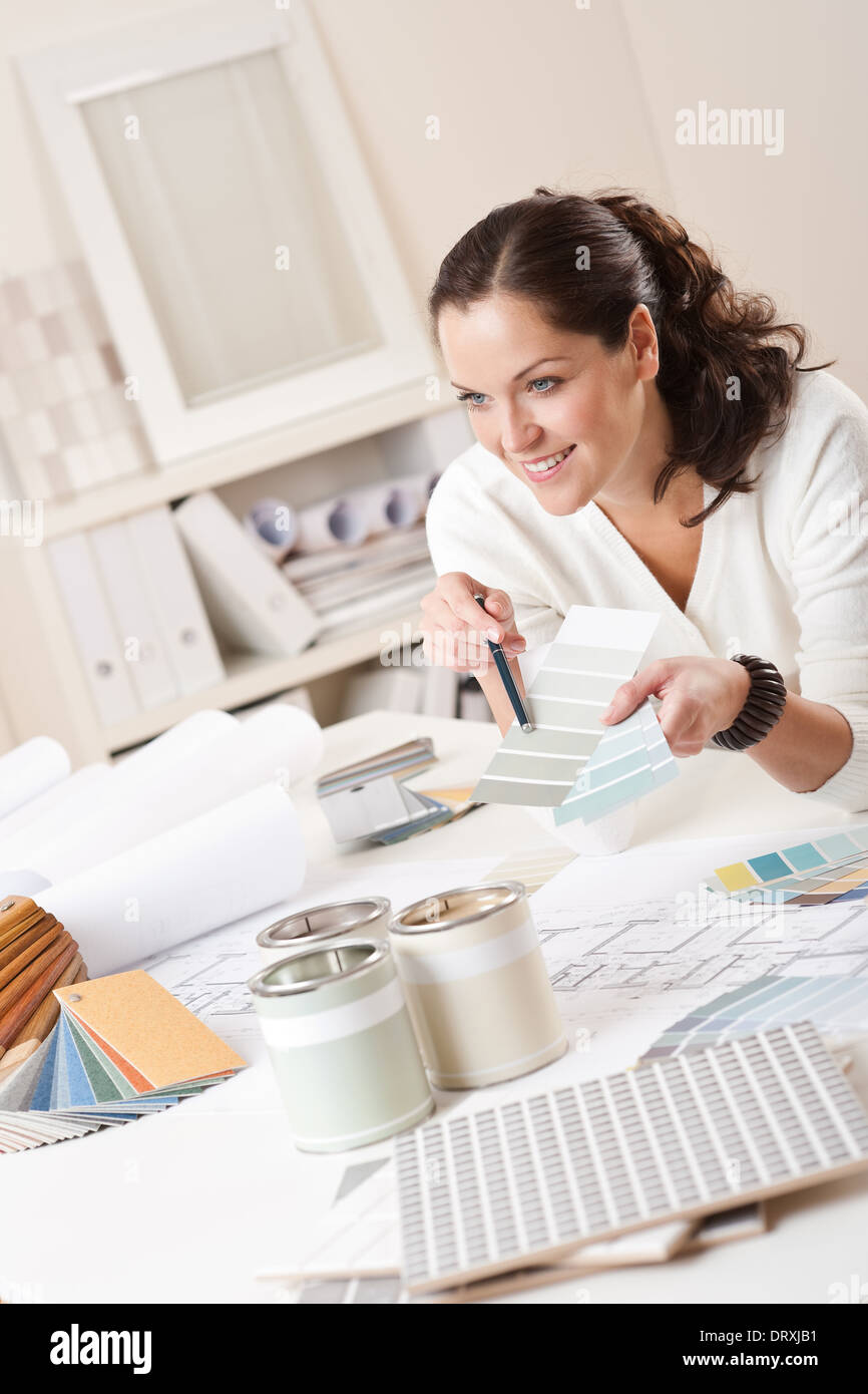 Female interior designer working at office Stock Photo - Alamy