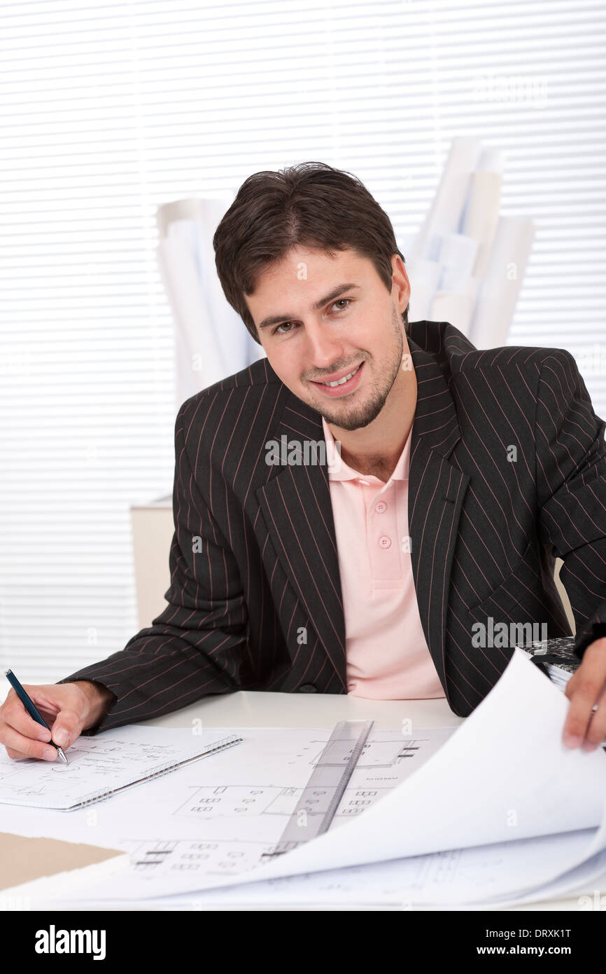 Successful architect man working with plans Stock Photo - Alamy