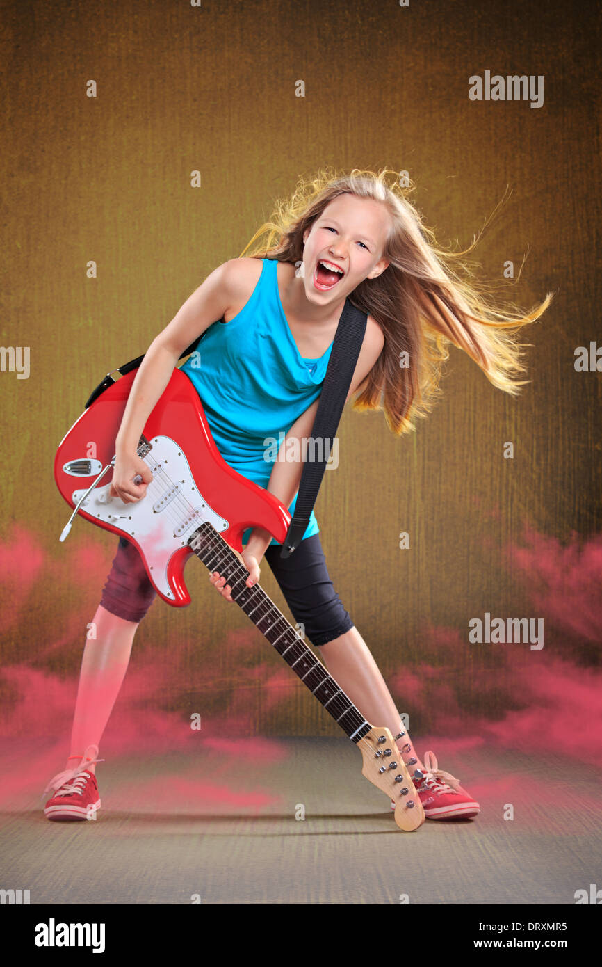 portrait of young girl with a guitar on the stage Stock Photo - Alamy