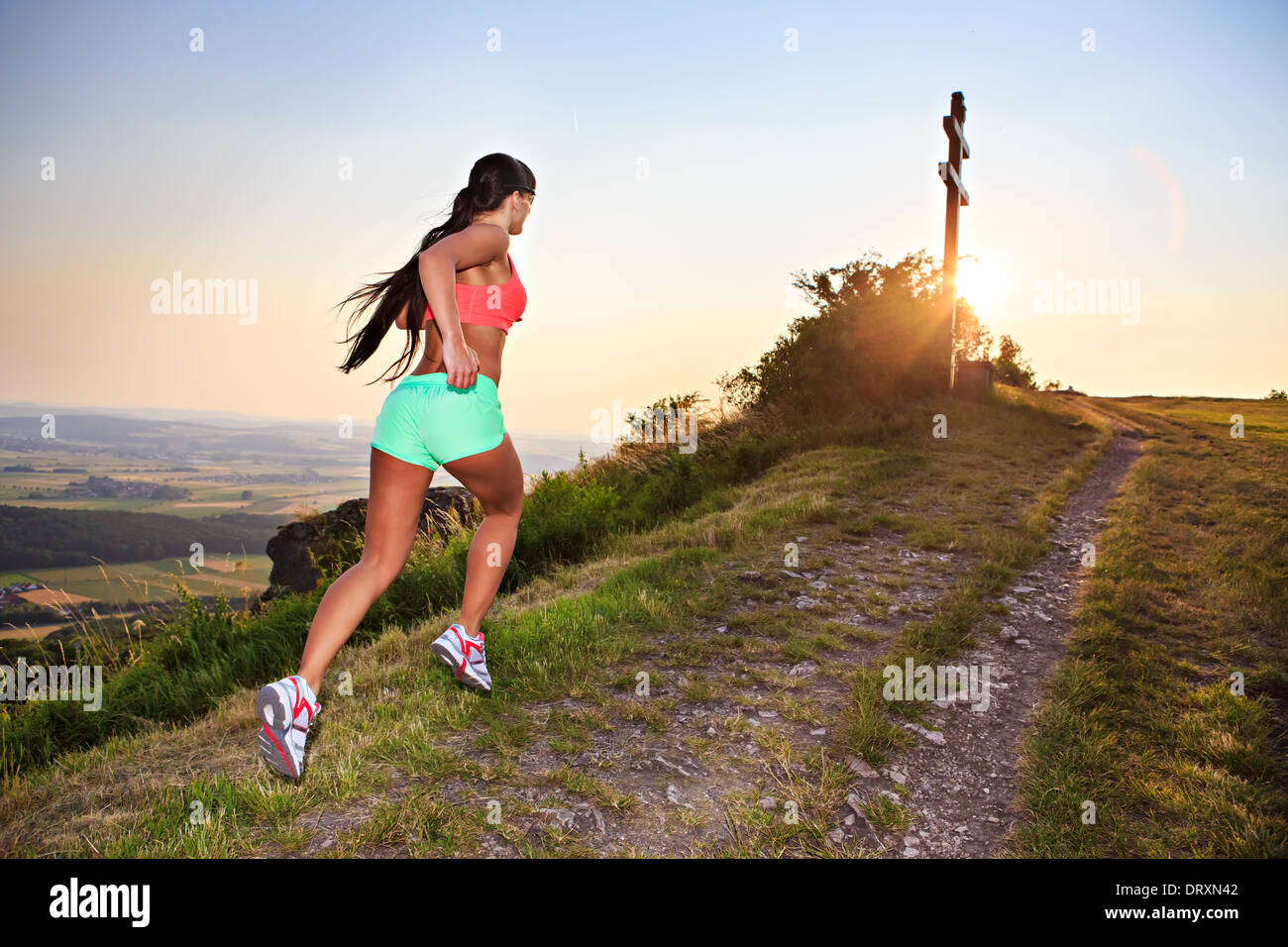 Woman young running sky fitness hi-res stock photography and images - Alamy