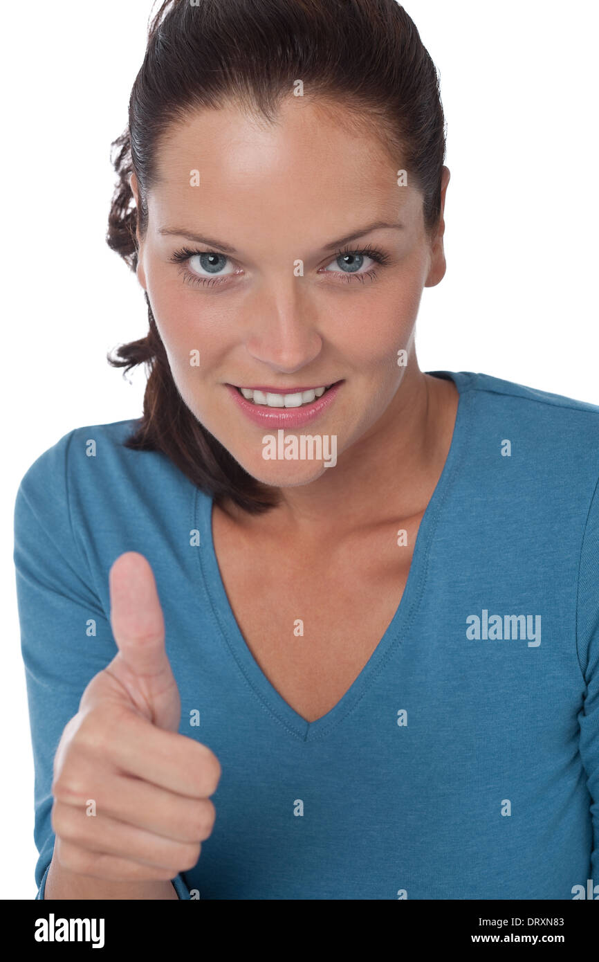 Young brown hair woman showing thumbs-up Stock Photo - Alamy