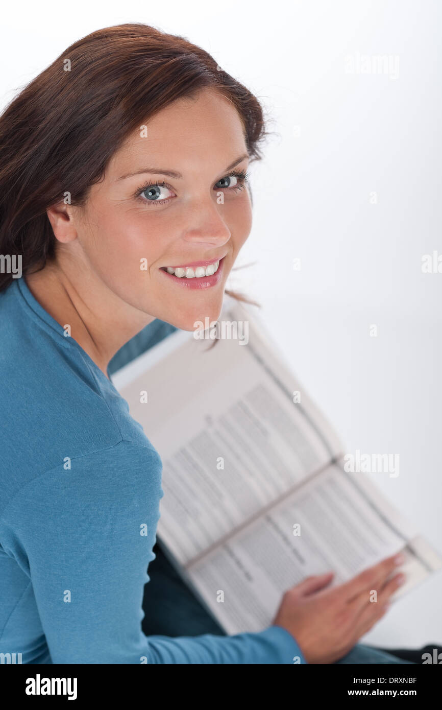 Smiling happy woman with book Stock Photo - Alamy