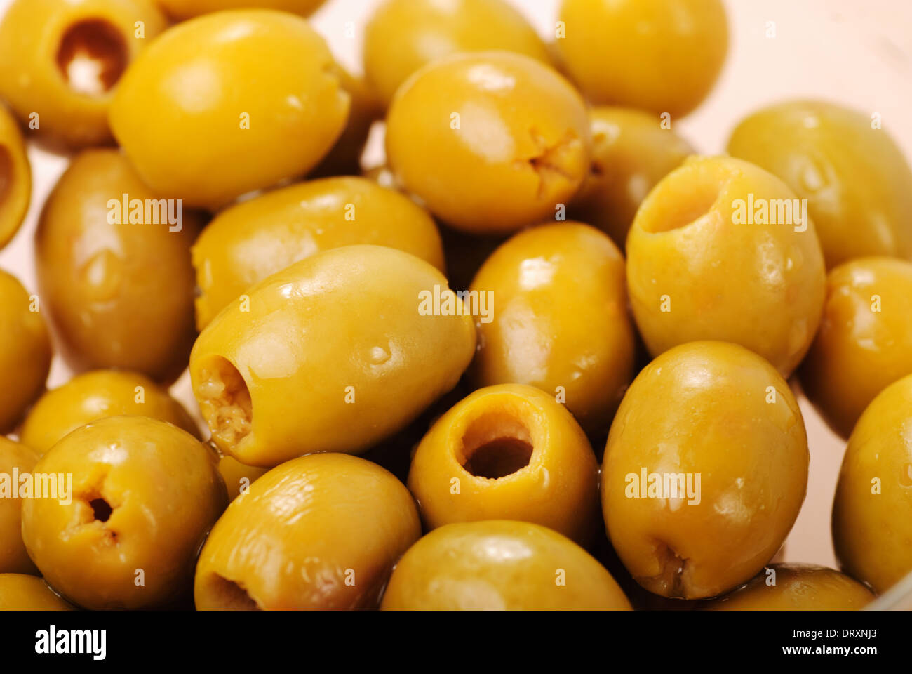 Marinated green olives close up Stock Photo - Alamy
