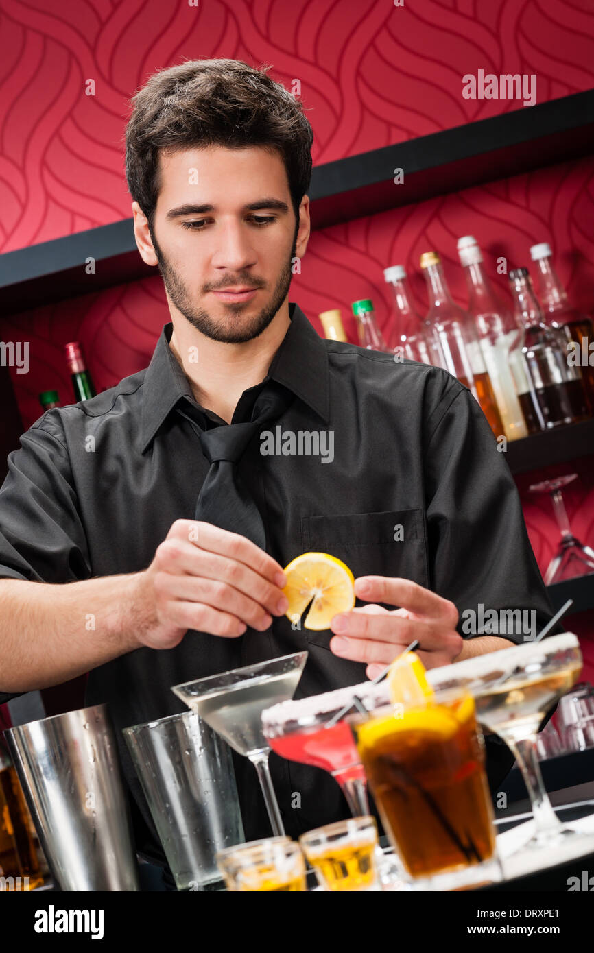 Young bartender make cocktail prepare drinks Stock Photo - Alamy