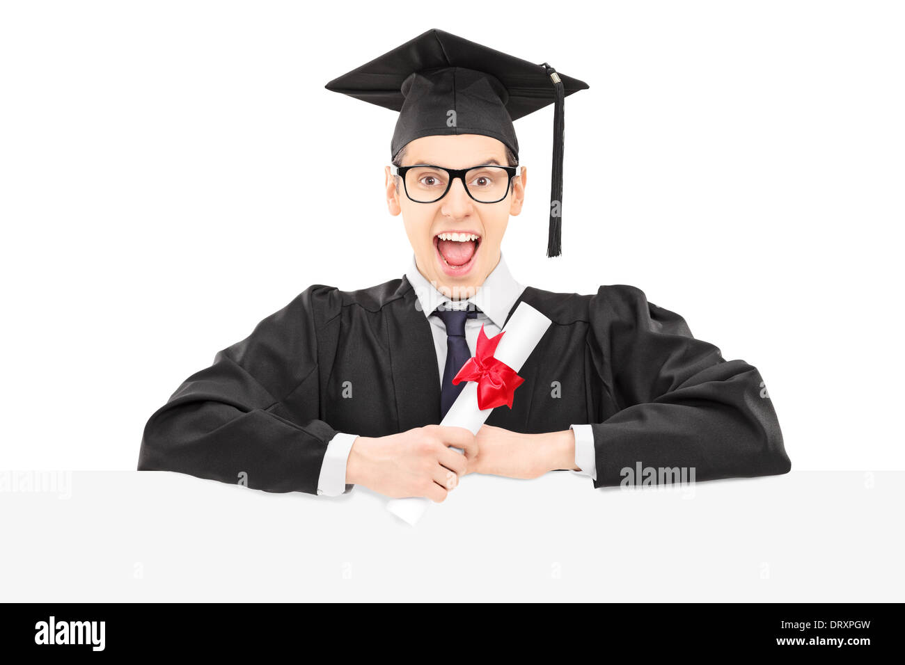 Excited college graduate holding a diploma and standing behind blank ...