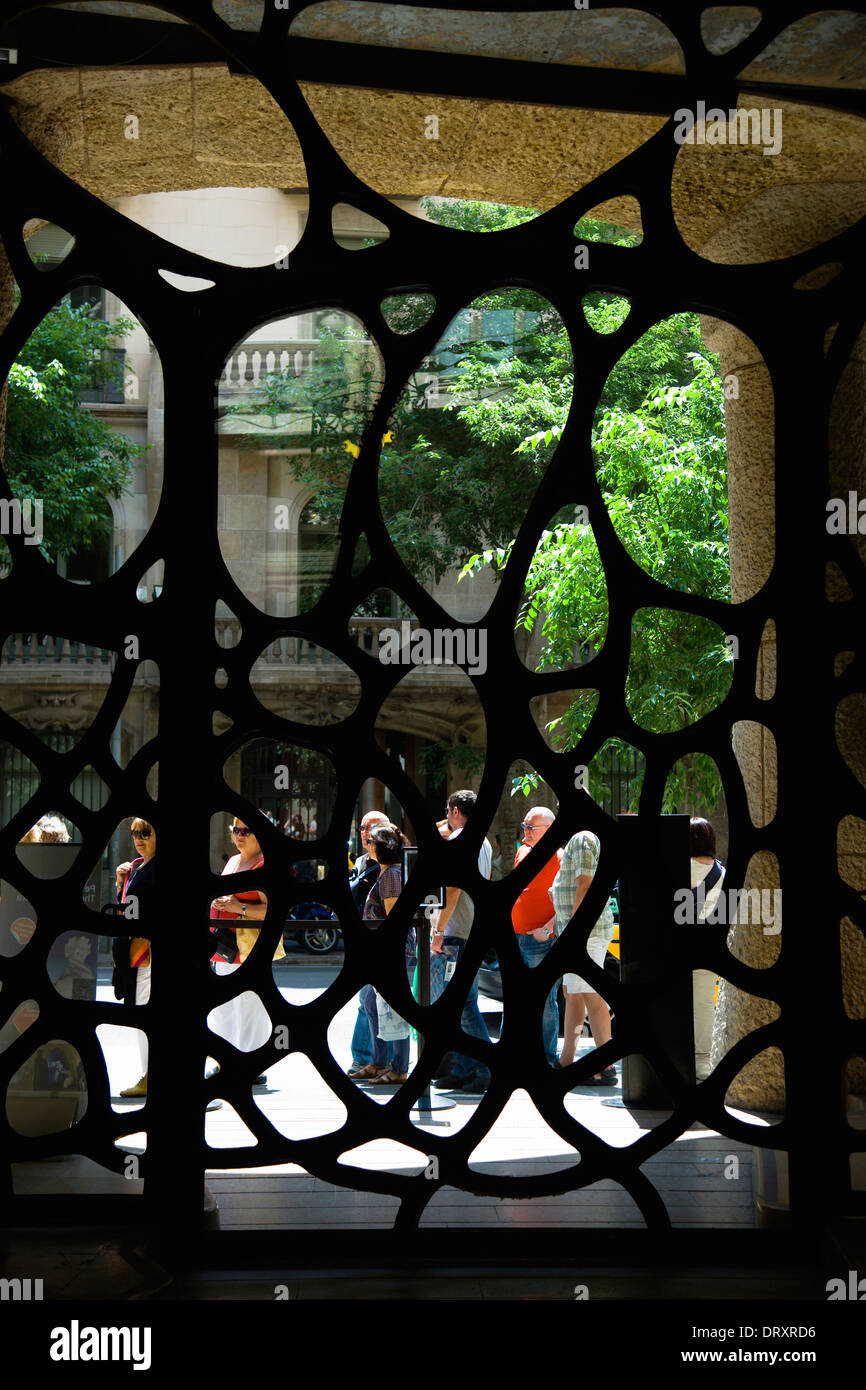 Spain, Catalonia, Barcelona, Gate from street to central courtyard of ...