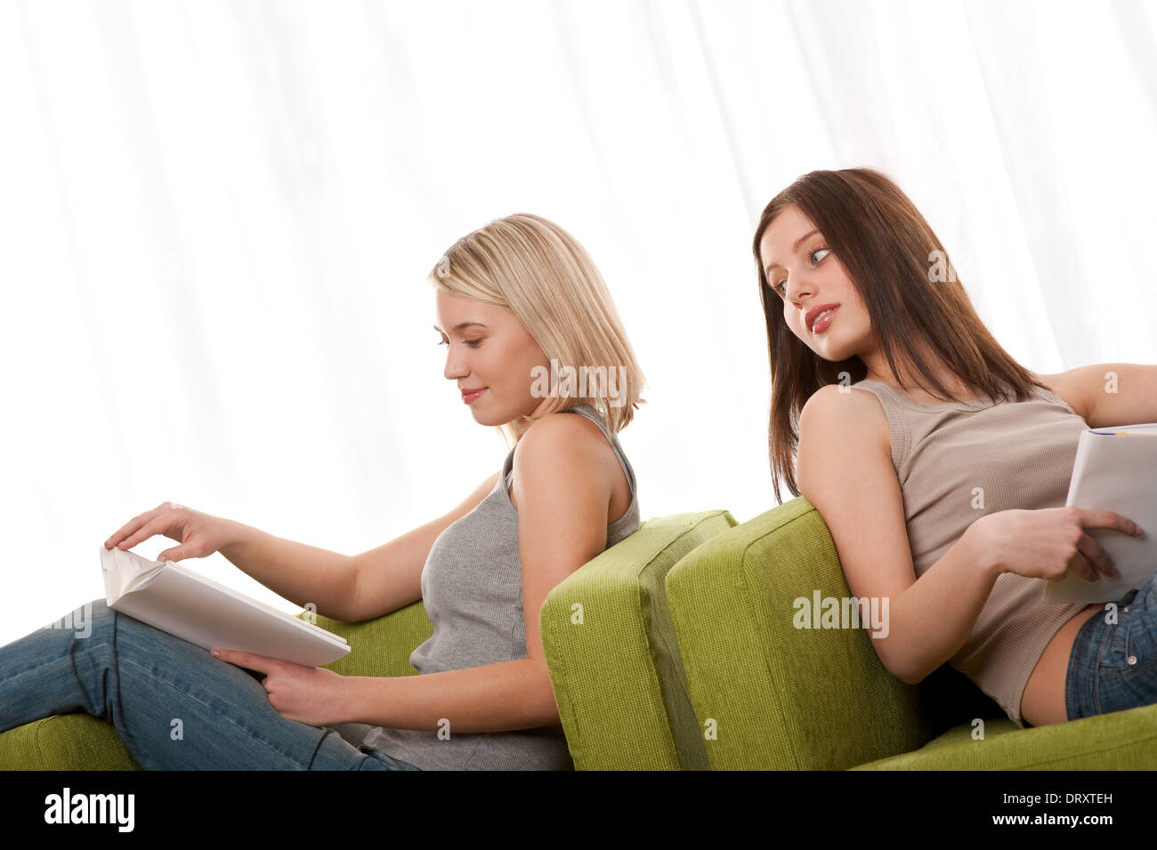 Student series - Two girls reading books Stock Photo - Alamy