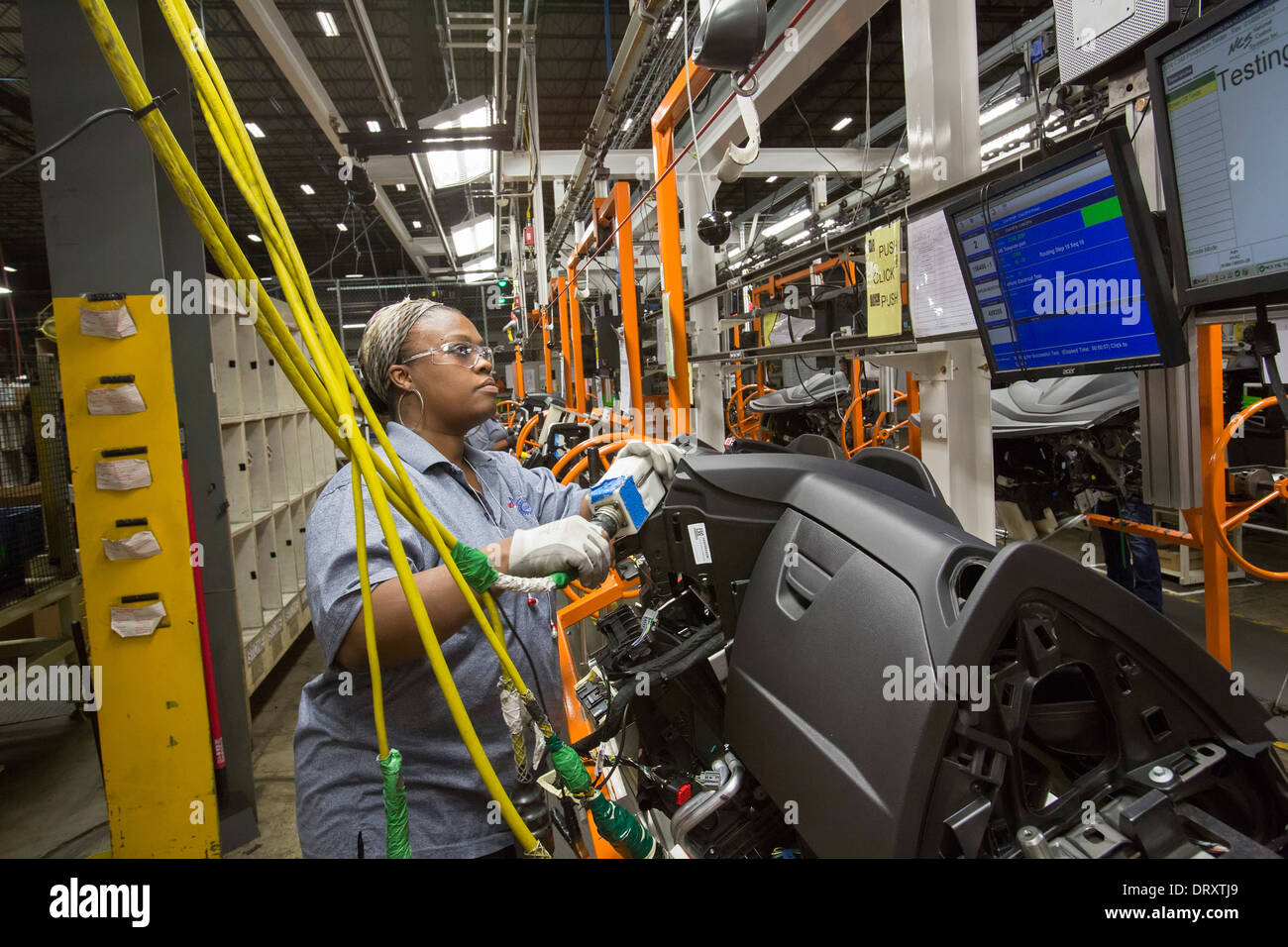 Workers make dashboards for Ford at Detroit Manufacturing Systems Stock ...