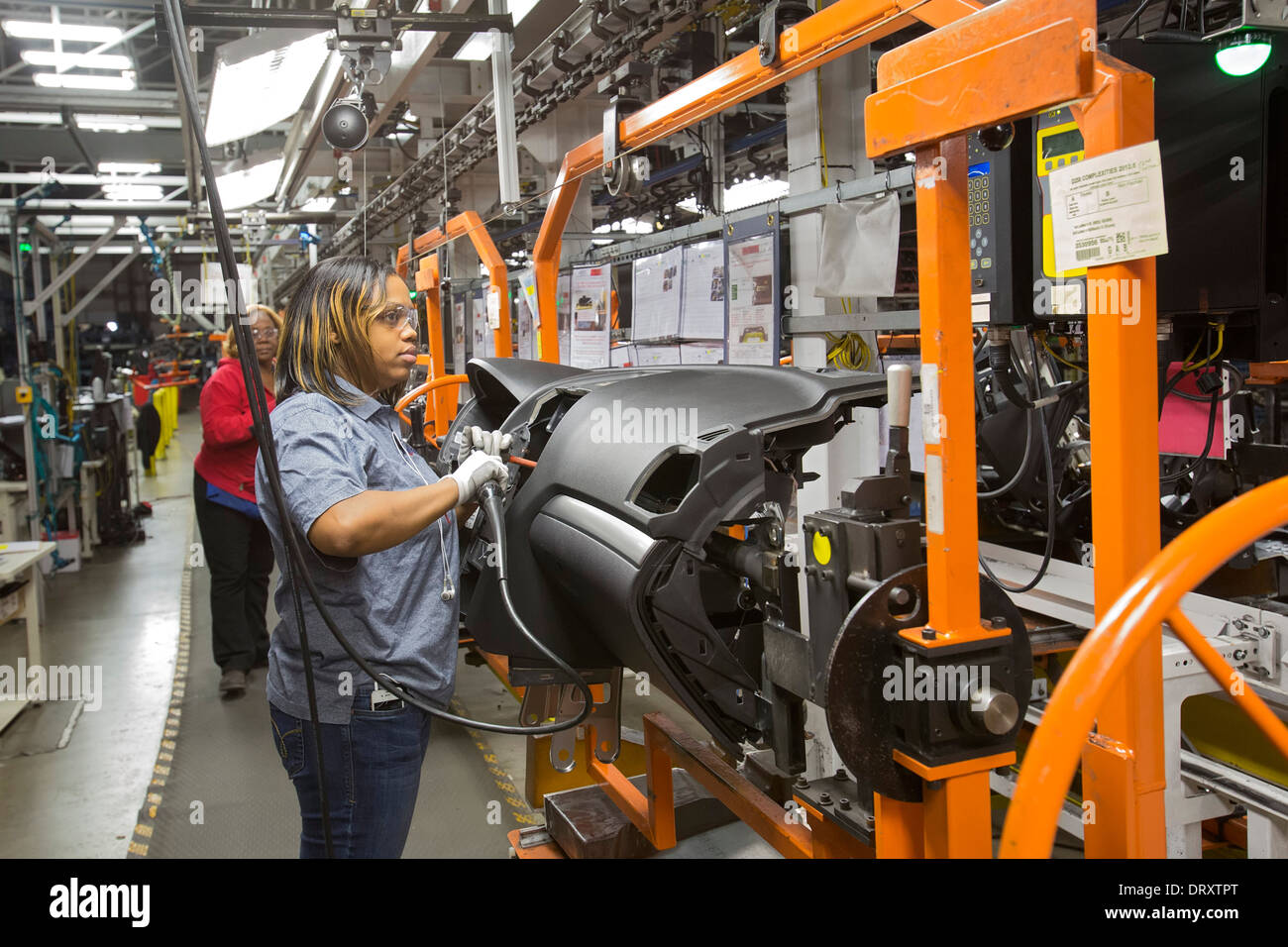 Workers make dashboards for Ford at Detroit Manufacturing Systems Stock ...