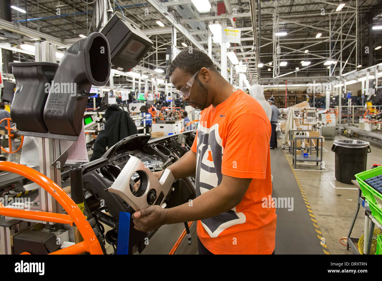 Workers make dashboards for Ford at Detroit Manufacturing Systems Stock ...