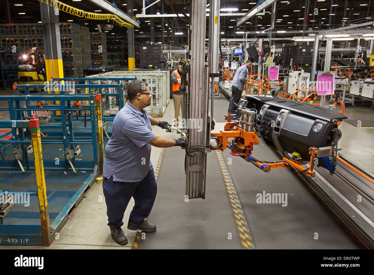 Workers make dashboards for Ford at Detroit Manufacturing Systems Stock ...