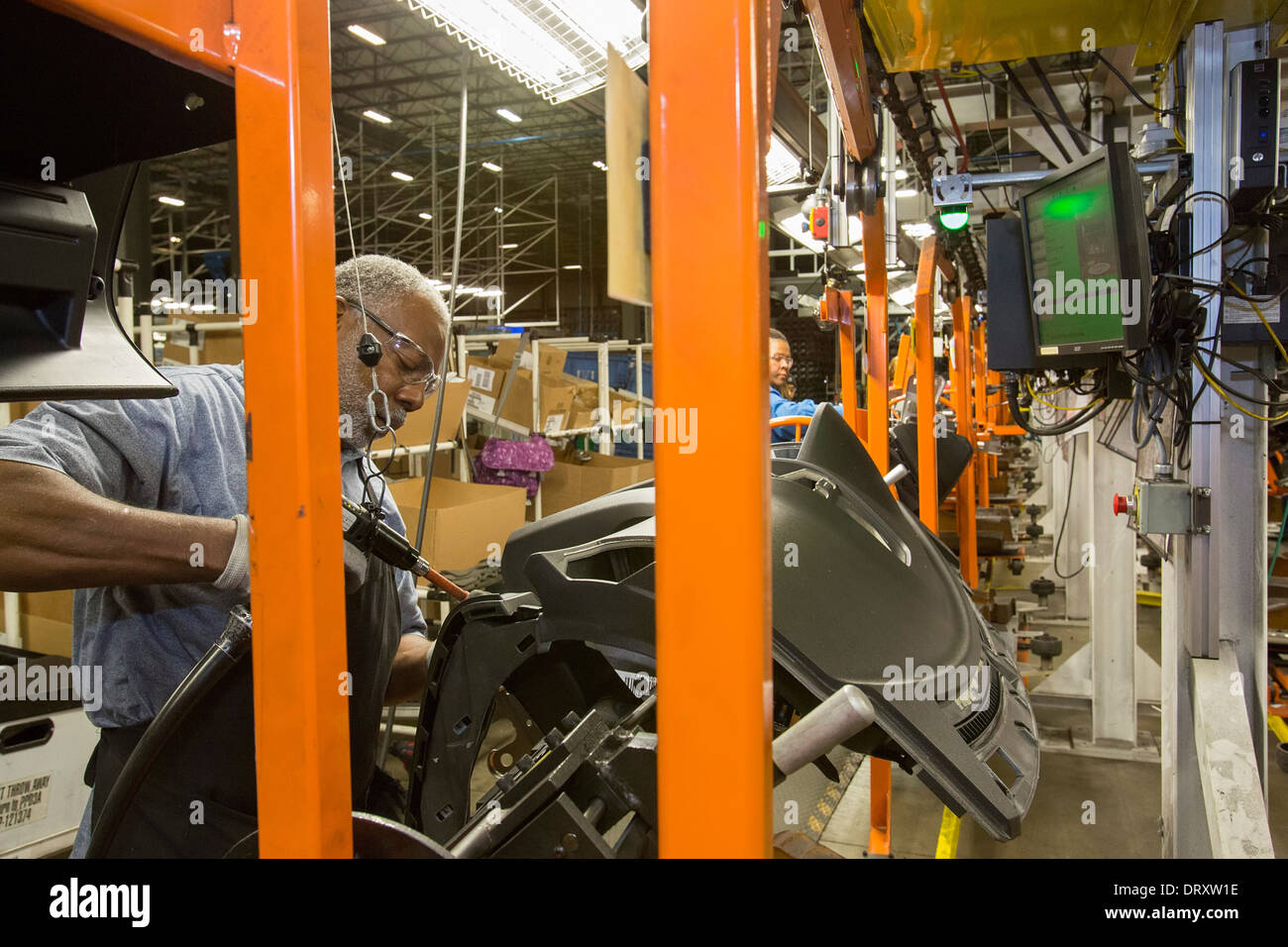 Workers make dashboards for Ford at Detroit Manufacturing Systems Stock ...