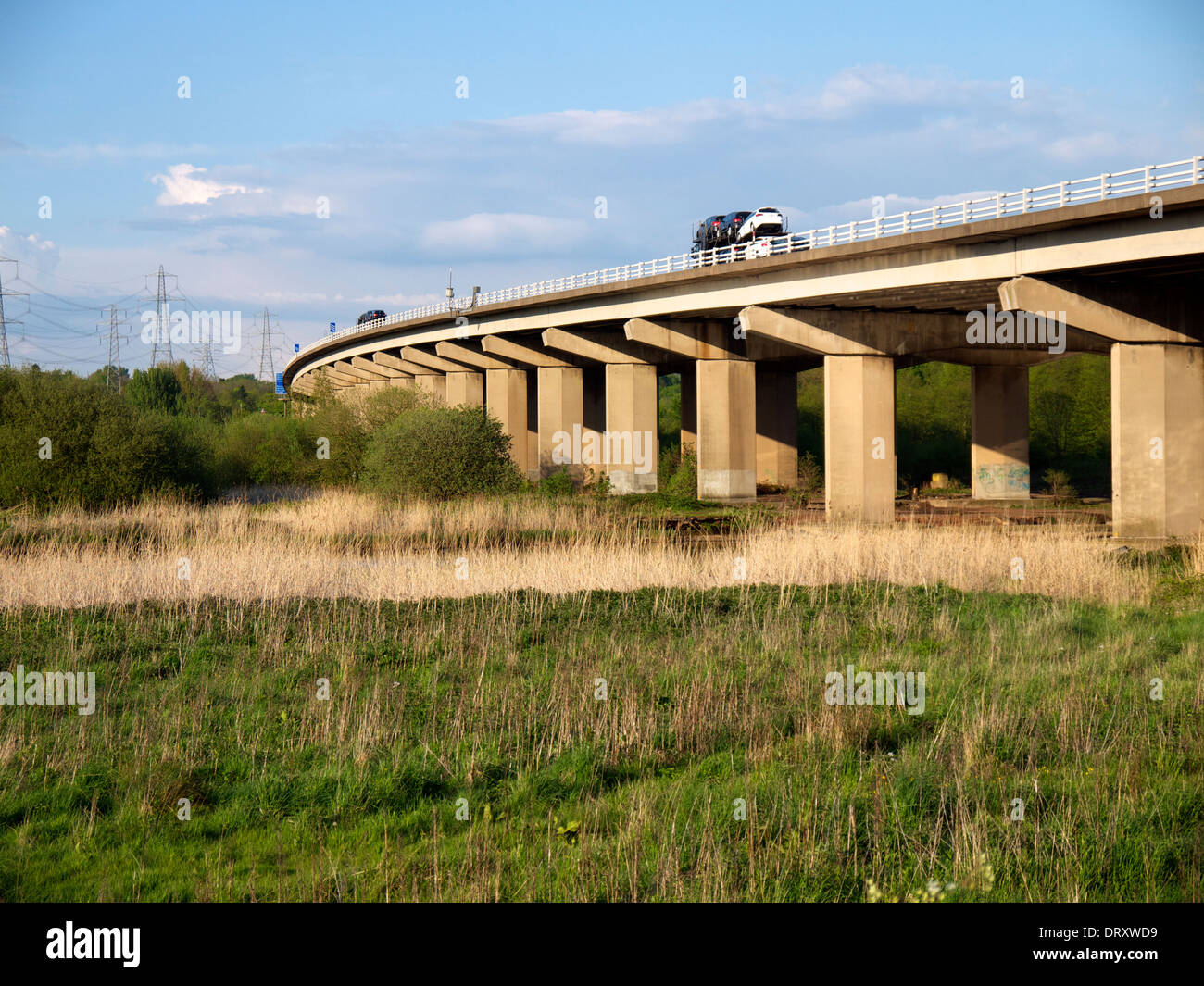 View of a motorway bridge from a field underneath it Stock Photo - Alamy