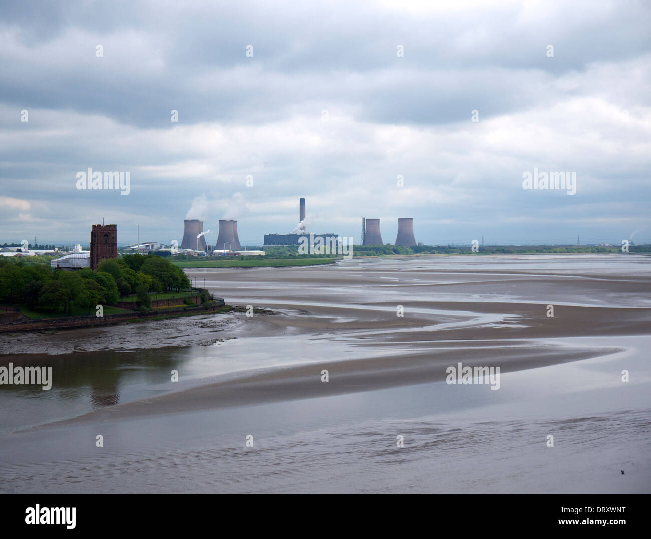 River with the tide out and a power station in the background Stock ...