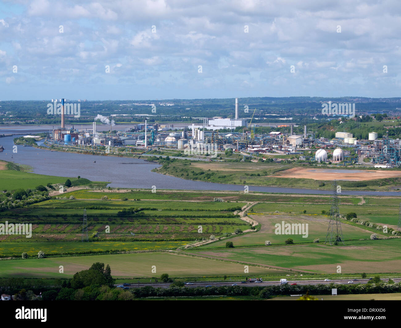 Farmers fields with industry running alongside a river Stock Photo - Alamy