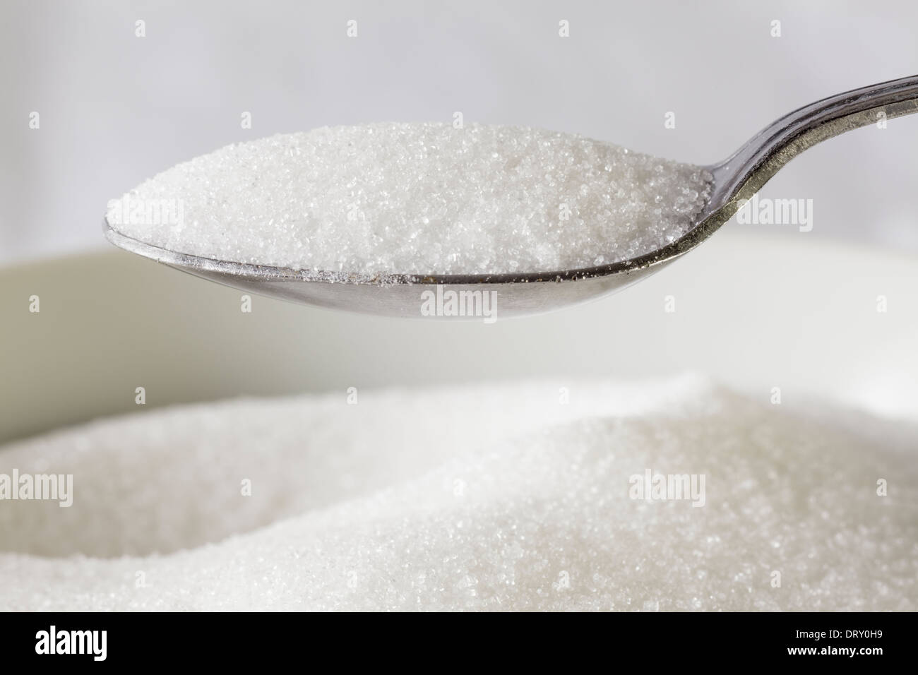 Spoon full of sugar Stock Photo - Alamy