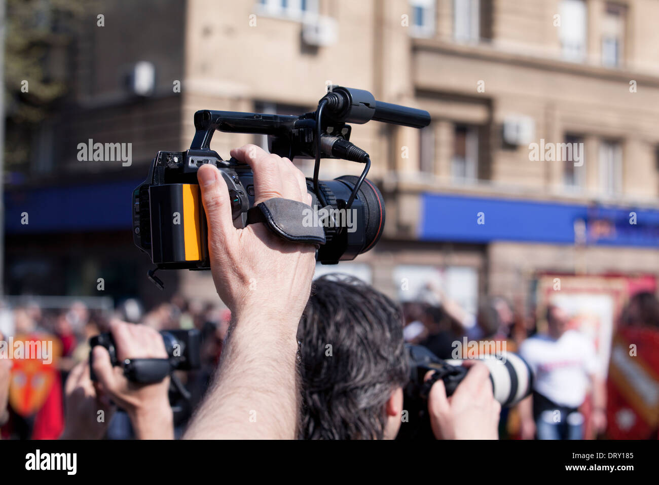 Hand cameraman holding video camera hi-res stock photography and images ...