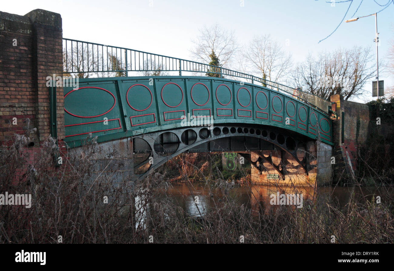 A narrow iron bridge over the River Wensum at Hellesdon, Norfolk ...