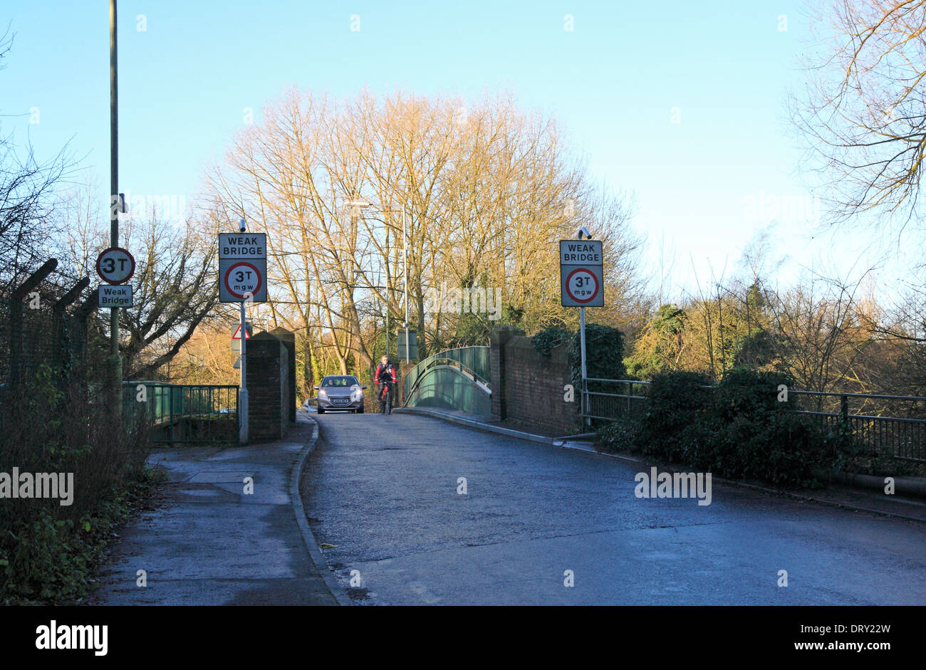 A narrow road bridge over the River Wensum at Hellesdon, Norfolk ...