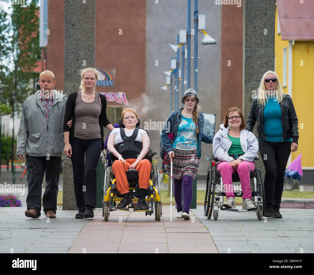 Enjoying a summer day in Reykjavik, disabled group being helped by ...