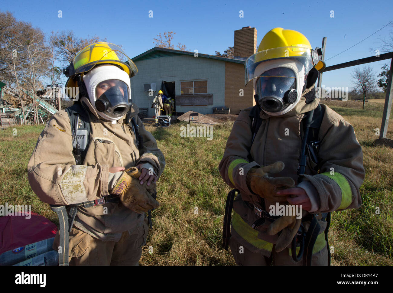 Students from high school fire training class prepare to practice fire ...