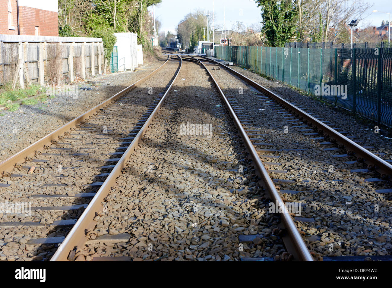 middle of two train tracks dunmurry belfast uk Stock Photo - Alamy