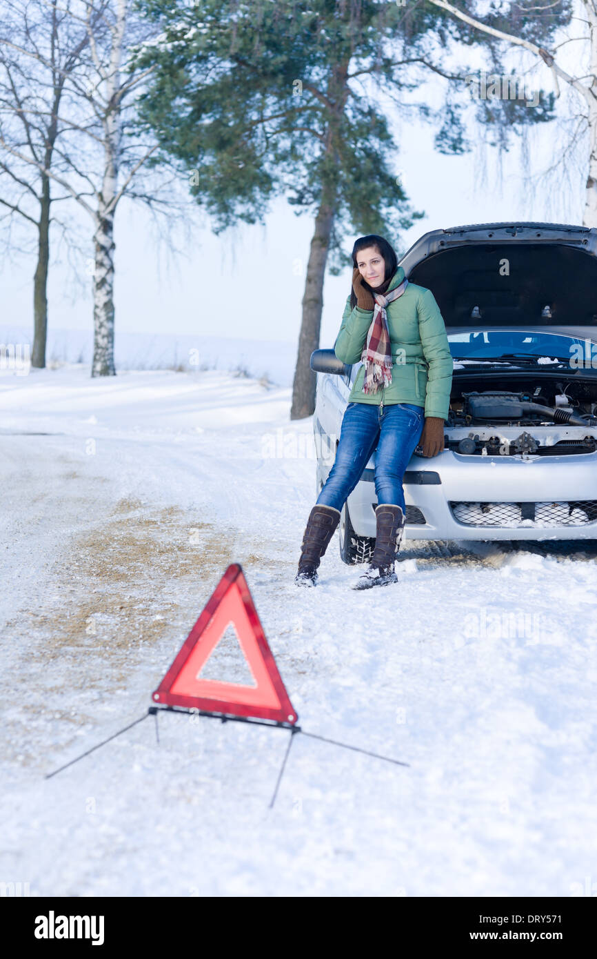 Winter car breakdown - woman call for help Stock Photo - Alamy