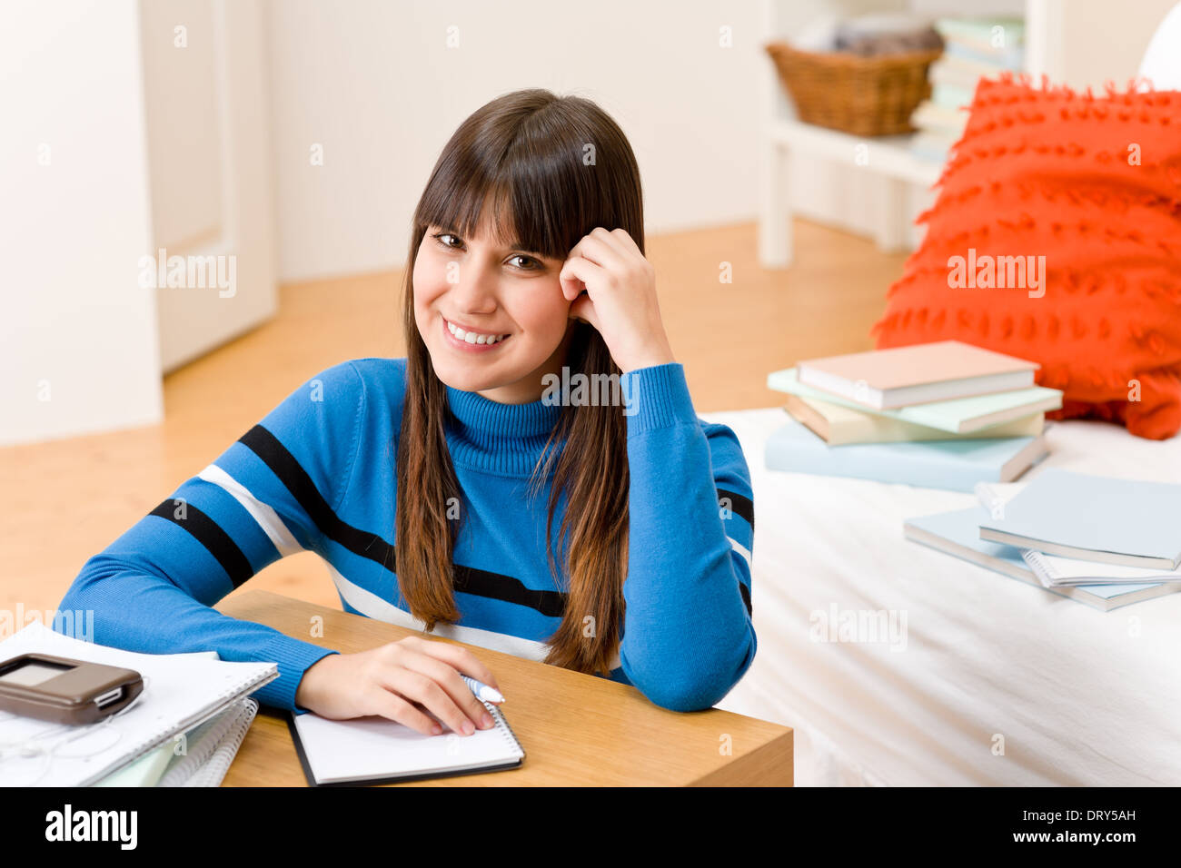 Teenager girl home - student write homework Stock Photo - Alamy
