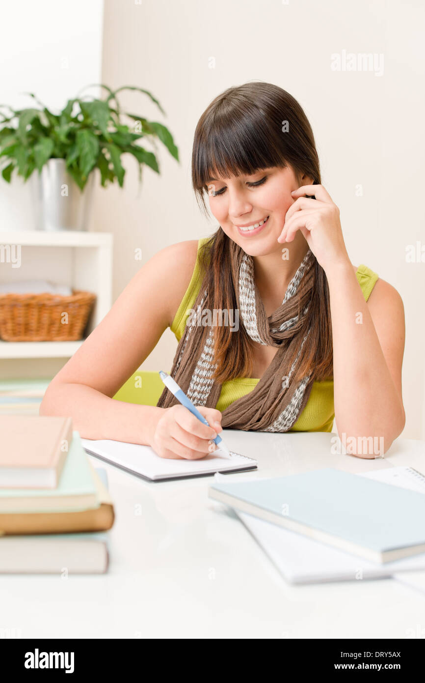 Teenager girl home - student write homework Stock Photo - Alamy