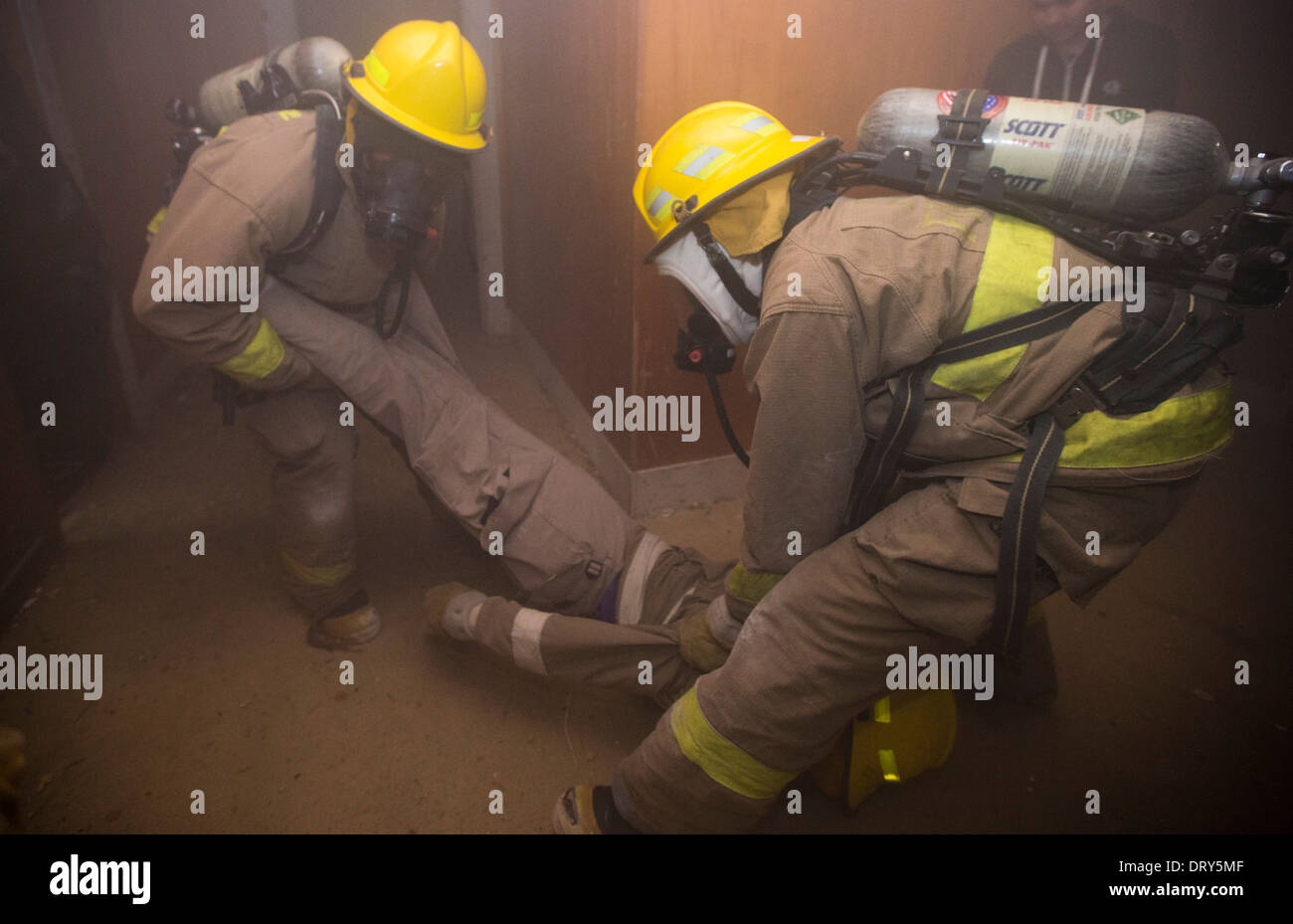 High school fire academy student trainees carry dummy to safety in ...