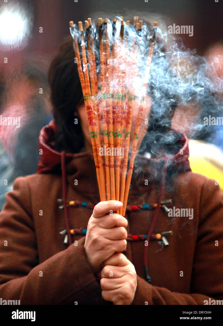 Beijing, CHINA, China. 31st Jan, 2014. Chinese light incense sticks and ...