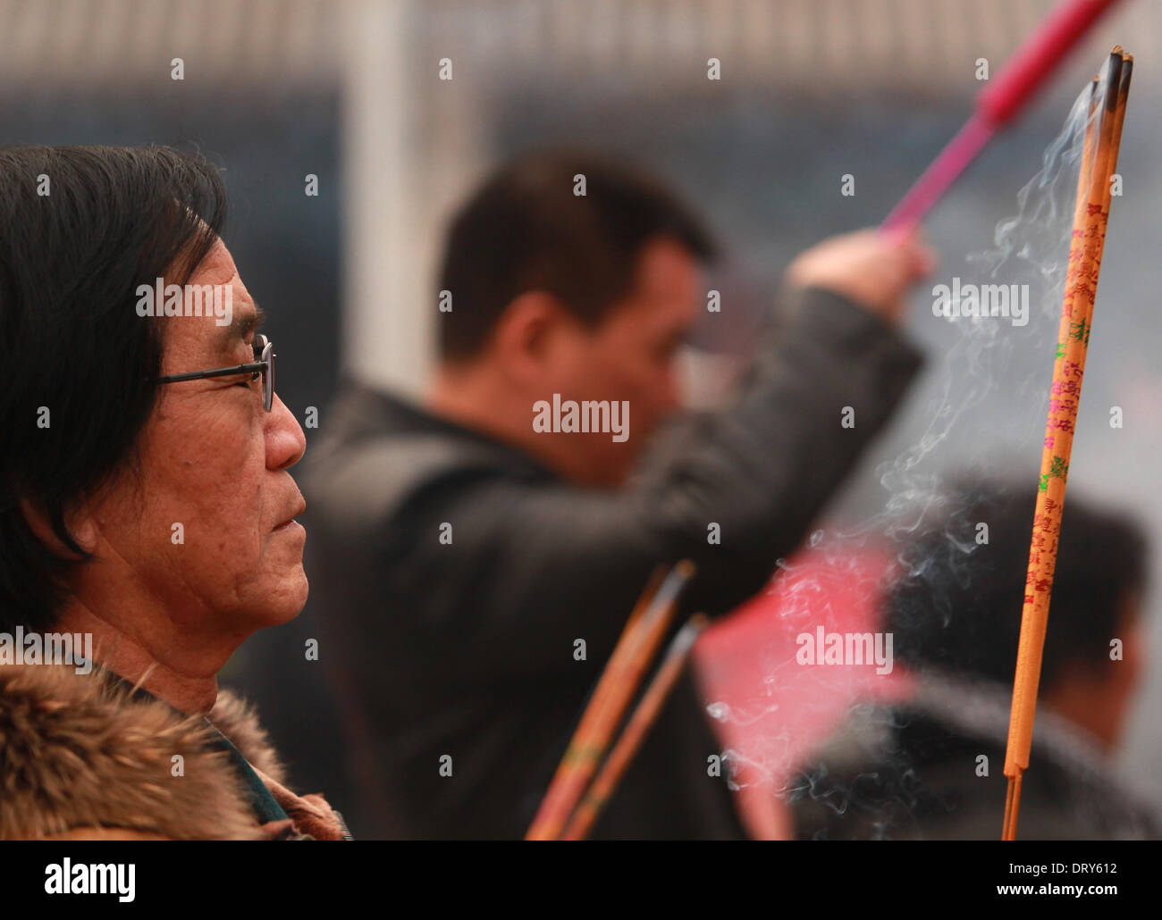 Beijing, CHINA, China. 31st Jan, 2014. Chinese light incense sticks and ...