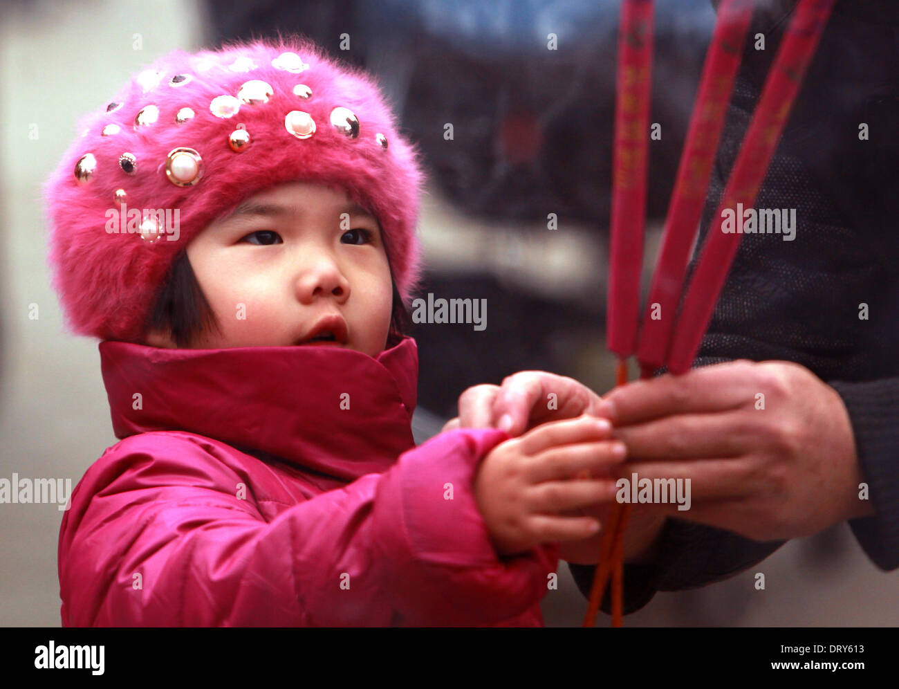 Beijing, CHINA, China. 31st Jan, 2014. Chinese light incense sticks and ...