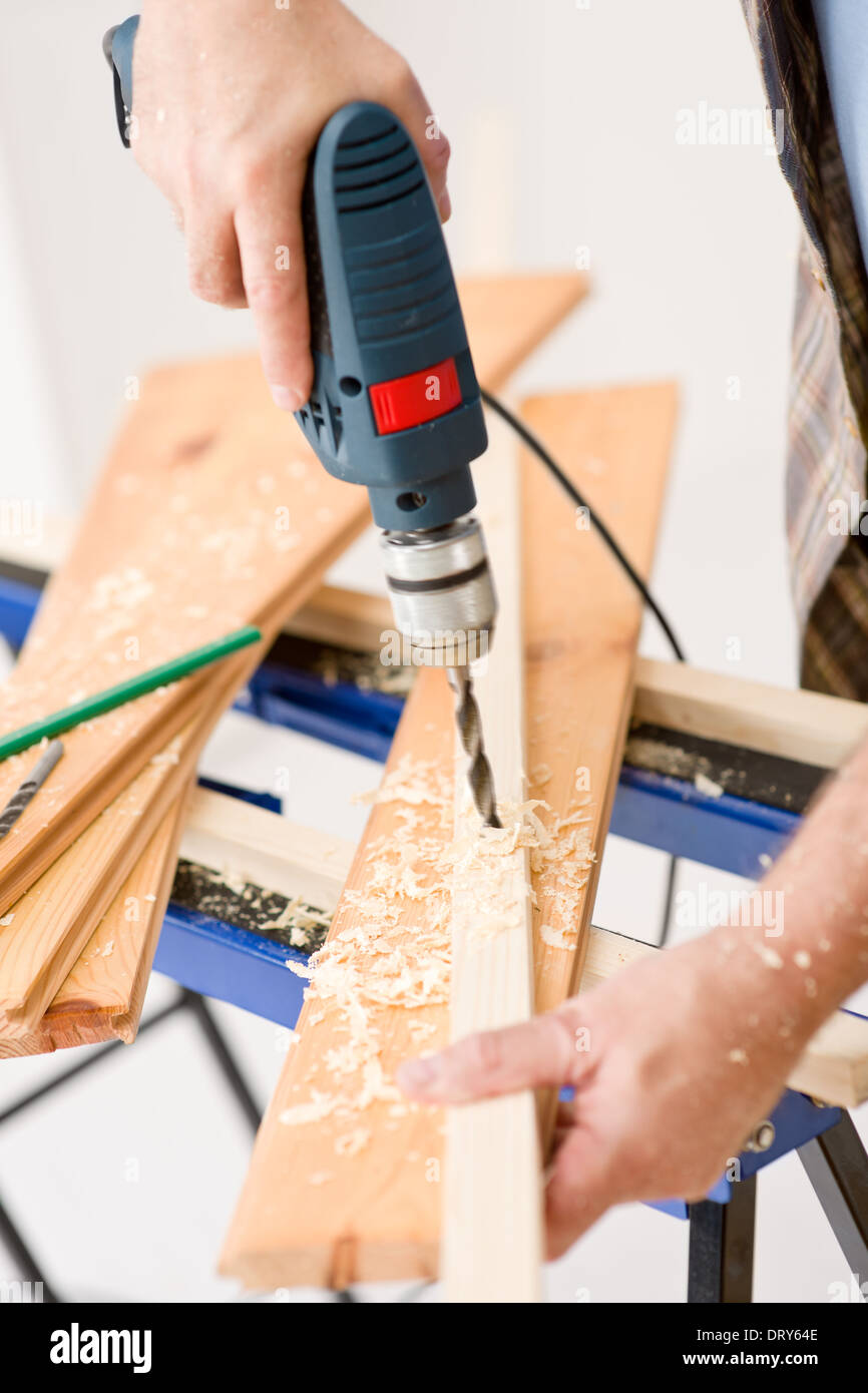 Handyman mature home improvement drilling hi-res stock photography and ...