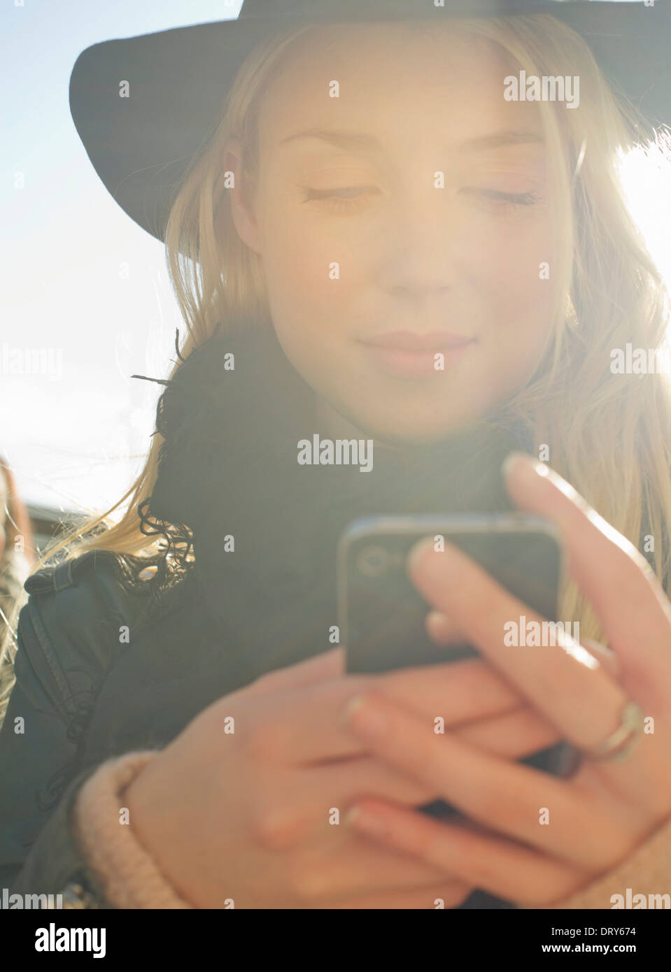 Young woman using smartphone Stock Photo - Alamy