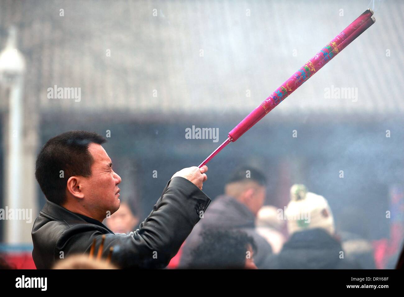 Beijing, CHINA, China. 31st Jan, 2014. Chinese light incense sticks and ...
