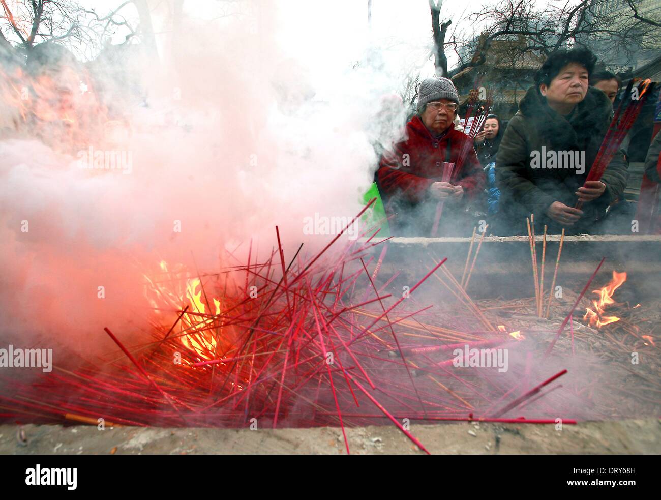 Beijing, CHINA, China. 31st Jan, 2014. Chinese light incense sticks and ...