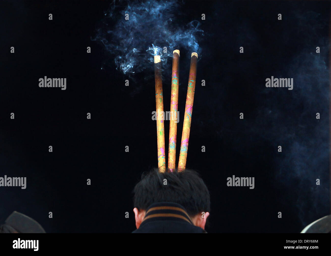 Beijing, CHINA, China. 31st Jan, 2014. Chinese light incense sticks and ...