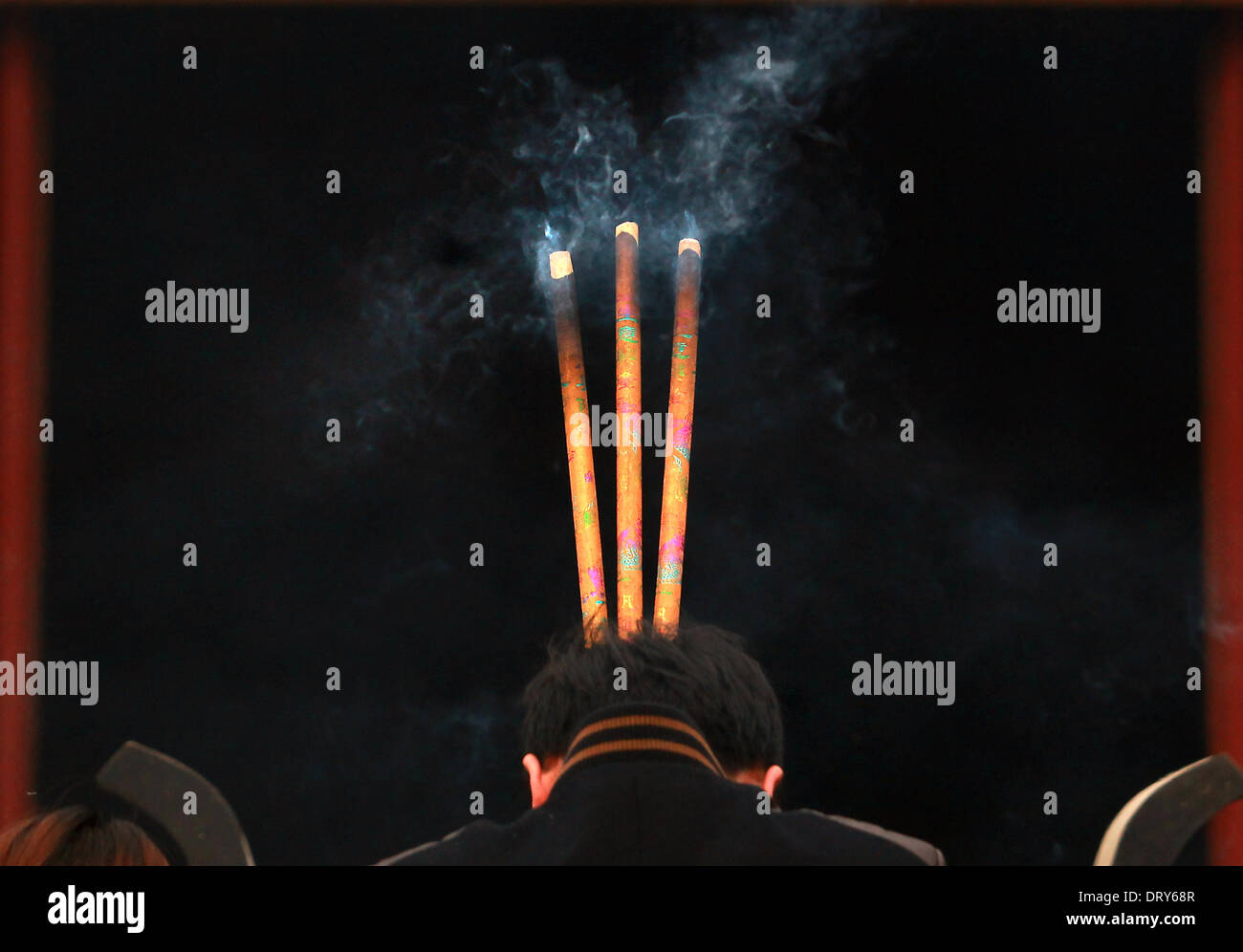 Beijing, CHINA, China. 31st Jan, 2014. Chinese light incense sticks and ...